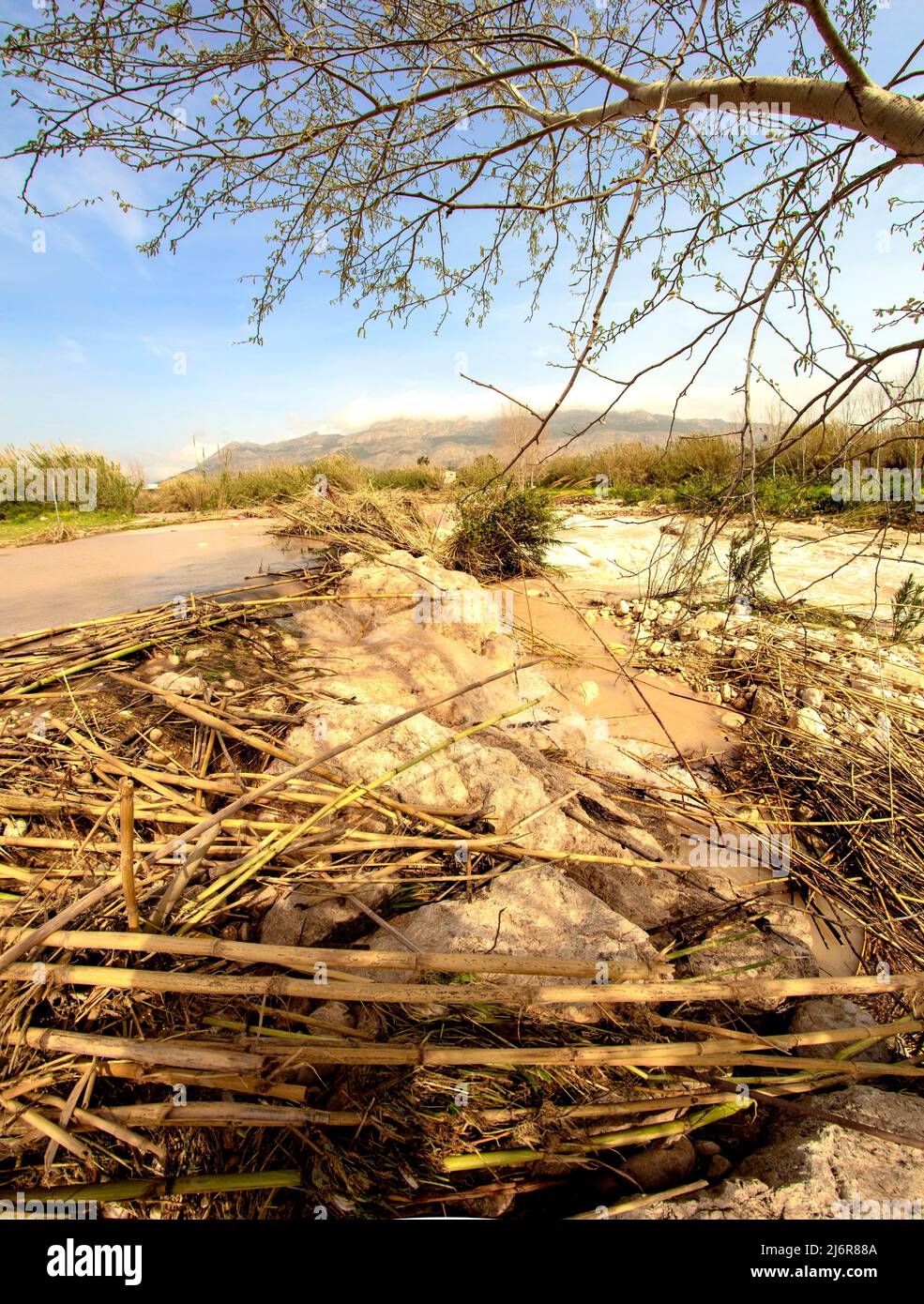 Natural landscape of Algar river in flood rushing under the road bridge ...