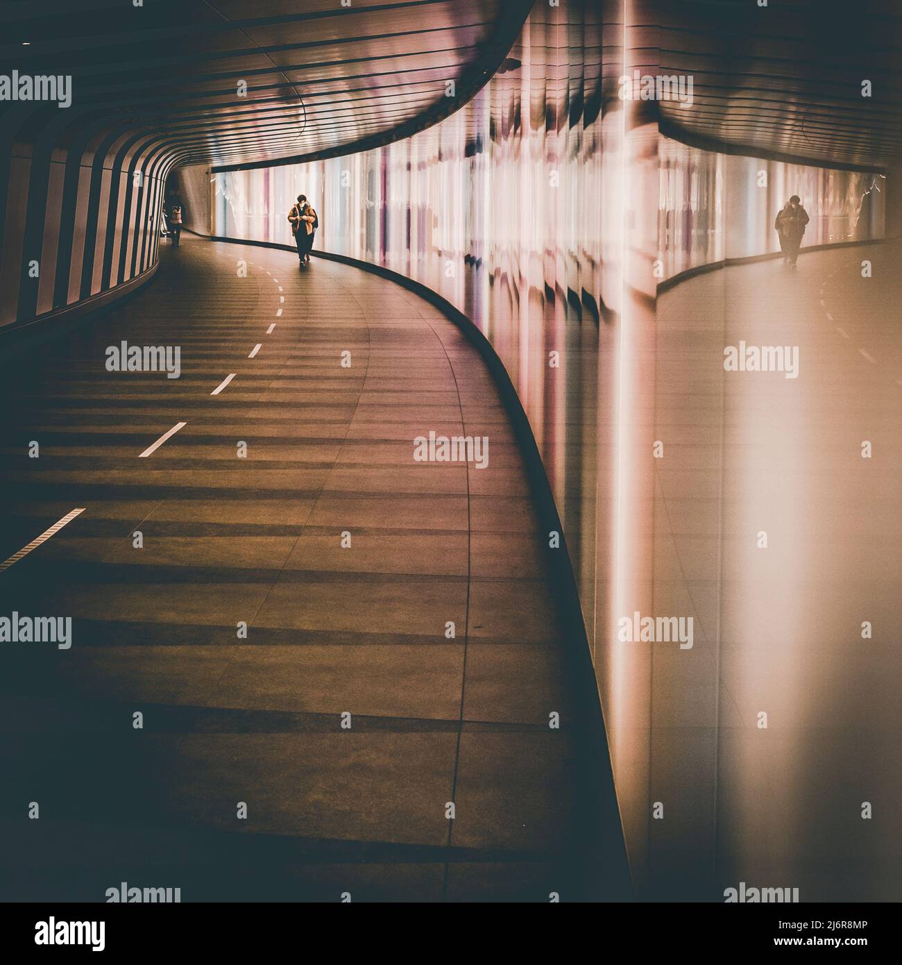 Futuristic looking pedestrian tunnel featuring an LED integrated light ...