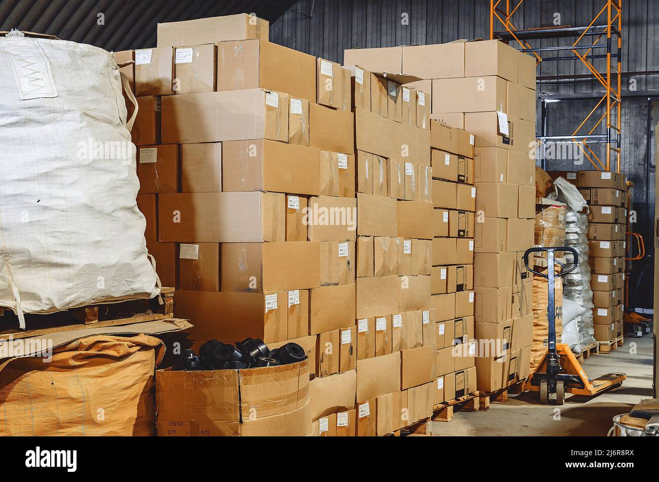 Cardboard boxes stacked in warehouse. Boxes with goods prepared for ...
