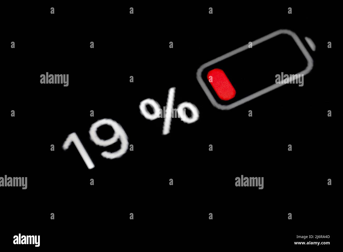 Smartphone charged battery level indicator - nineteen percent: close up ...