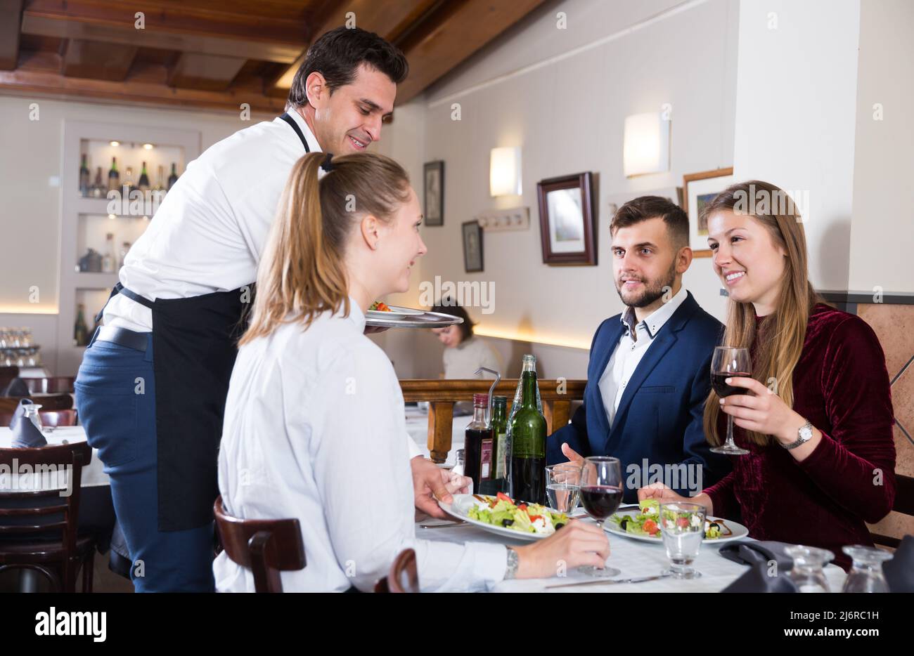 Handsome waiter restaurant interior hi-res stock photography and images ...