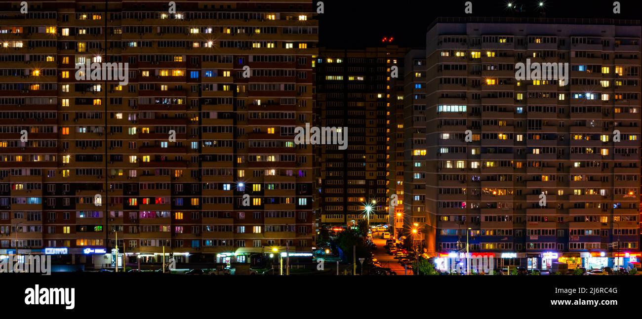 High-rise residential buildings with light in the windows late at night ...