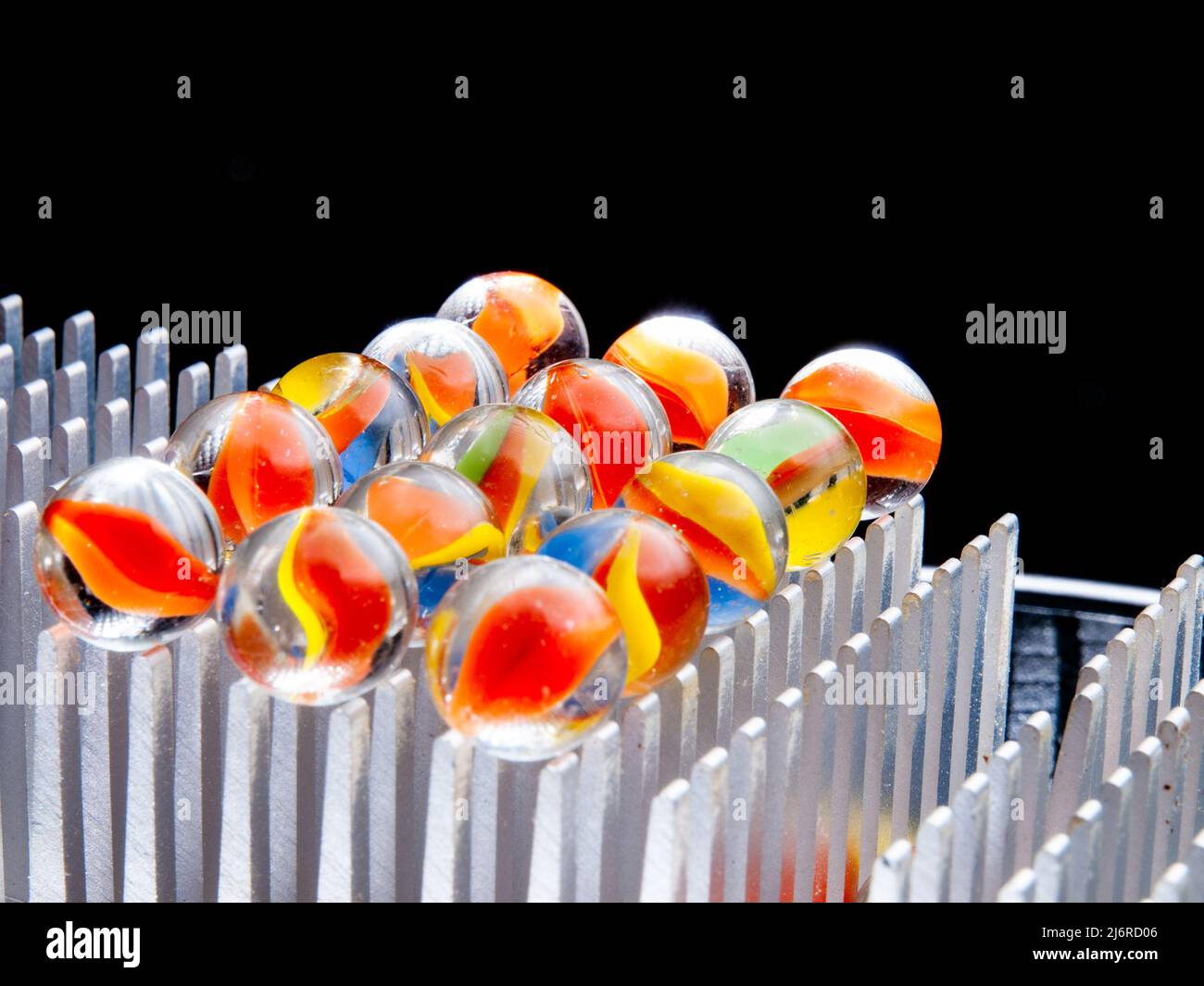 Colored glass marbles to illustrate concepts Stock Photo - Alamy