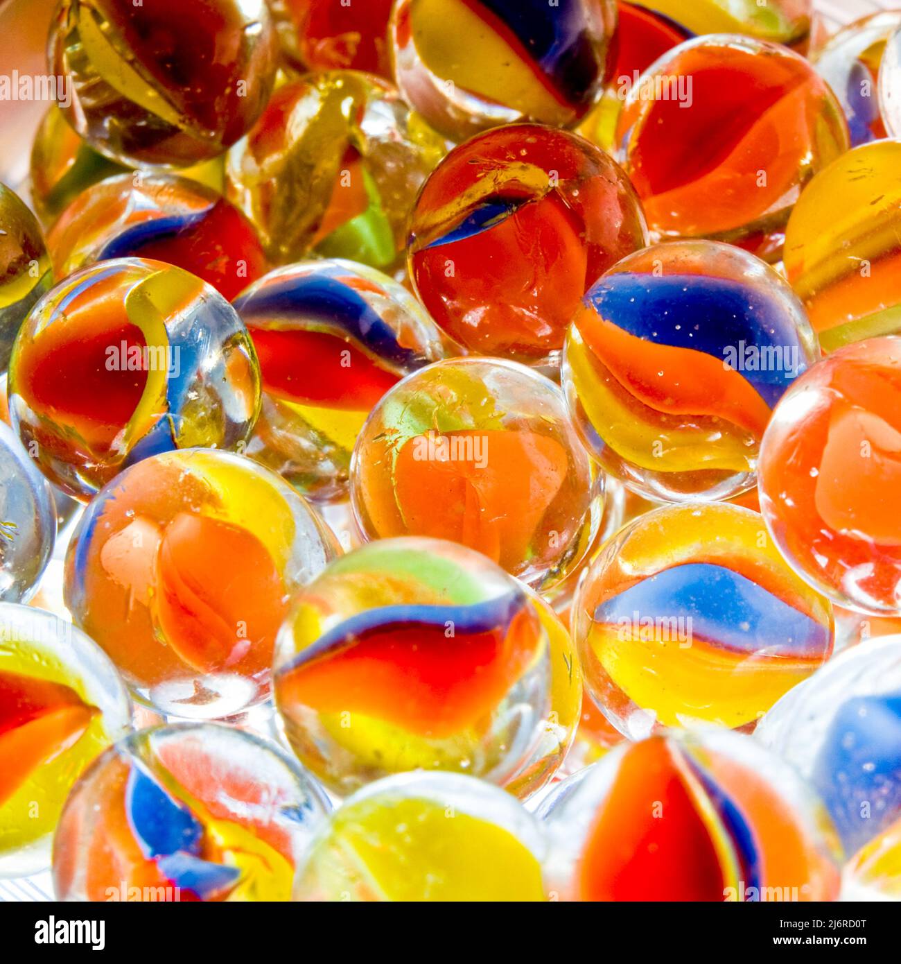 Colored glass marbles to illustrate concepts Stock Photo - Alamy