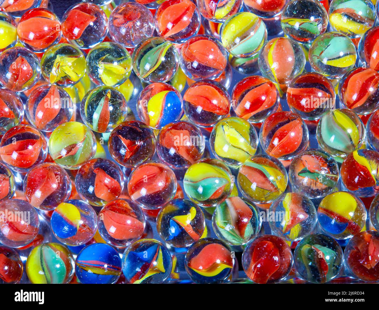 Colored glass marbles to illustrate concepts Stock Photo - Alamy