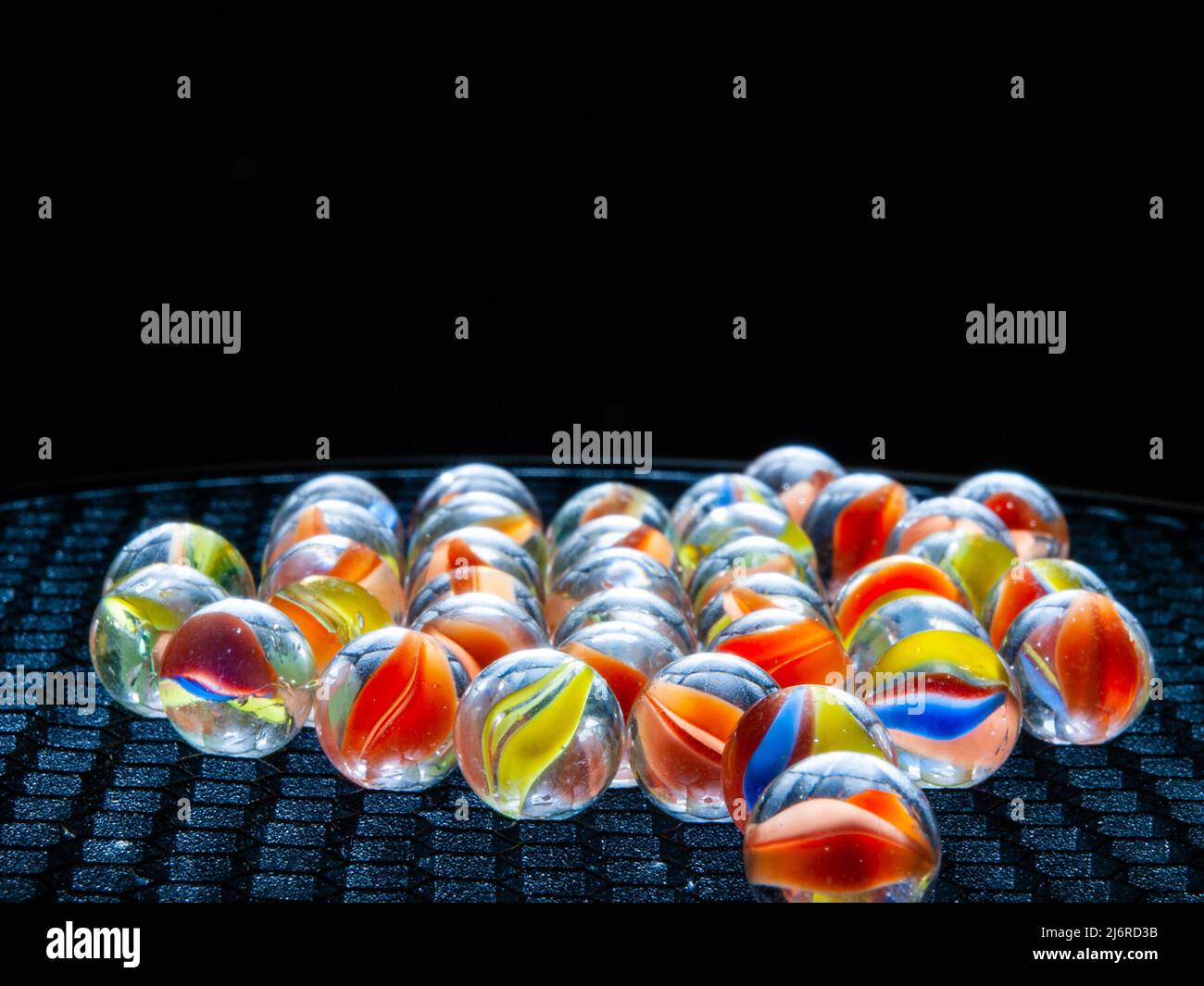 Colored glass marbles to illustrate concepts Stock Photo - Alamy