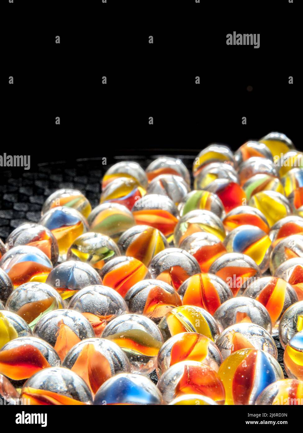 Colored glass marbles to illustrate concepts Stock Photo - Alamy