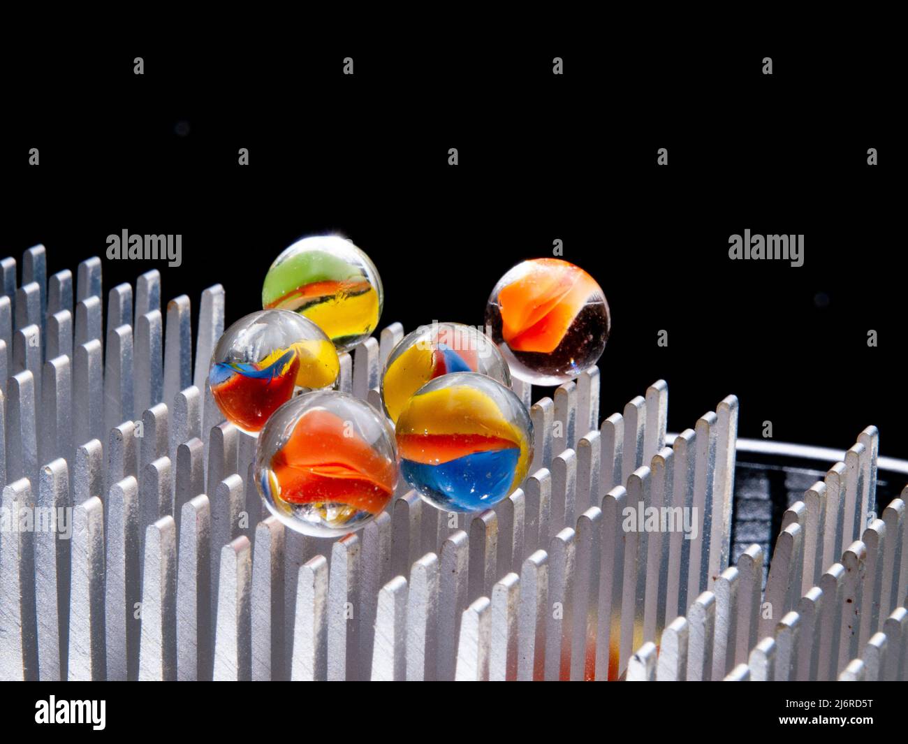 Colored glass marbles to illustrate concepts Stock Photo - Alamy