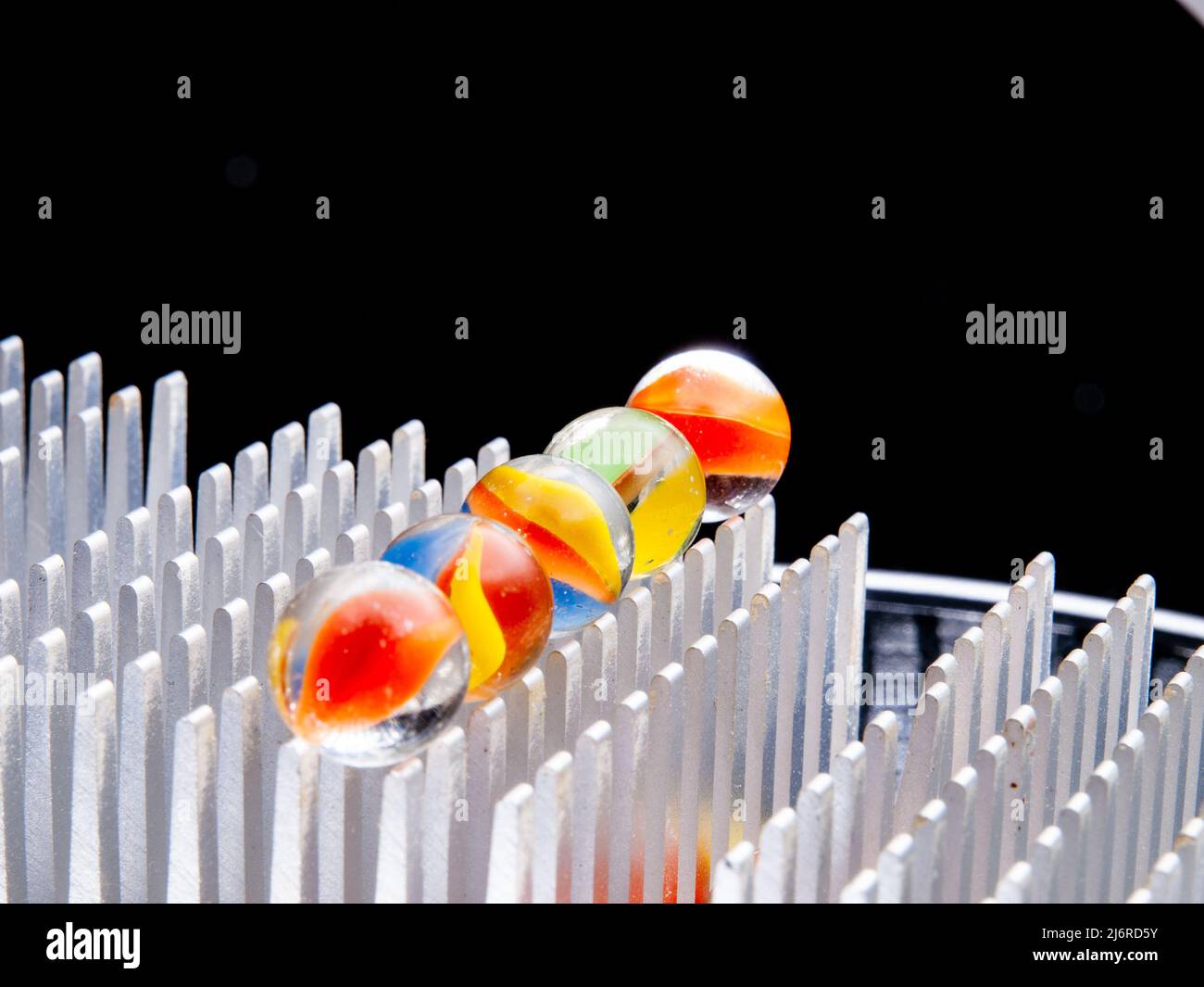 Colored glass marbles to illustrate concepts Stock Photo - Alamy