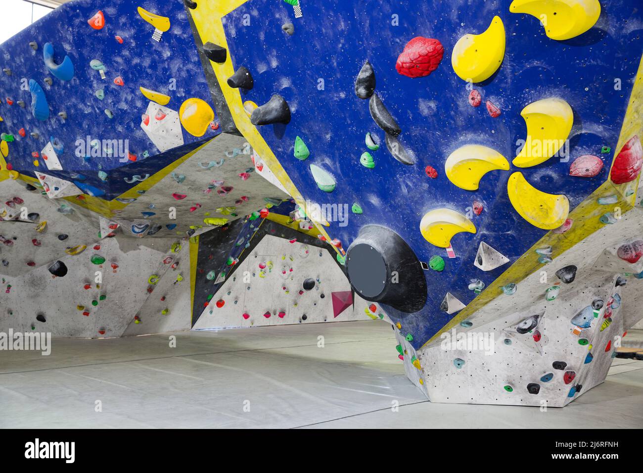 Artificial rock climbing wall for workout indoors Stock Photo - Alamy