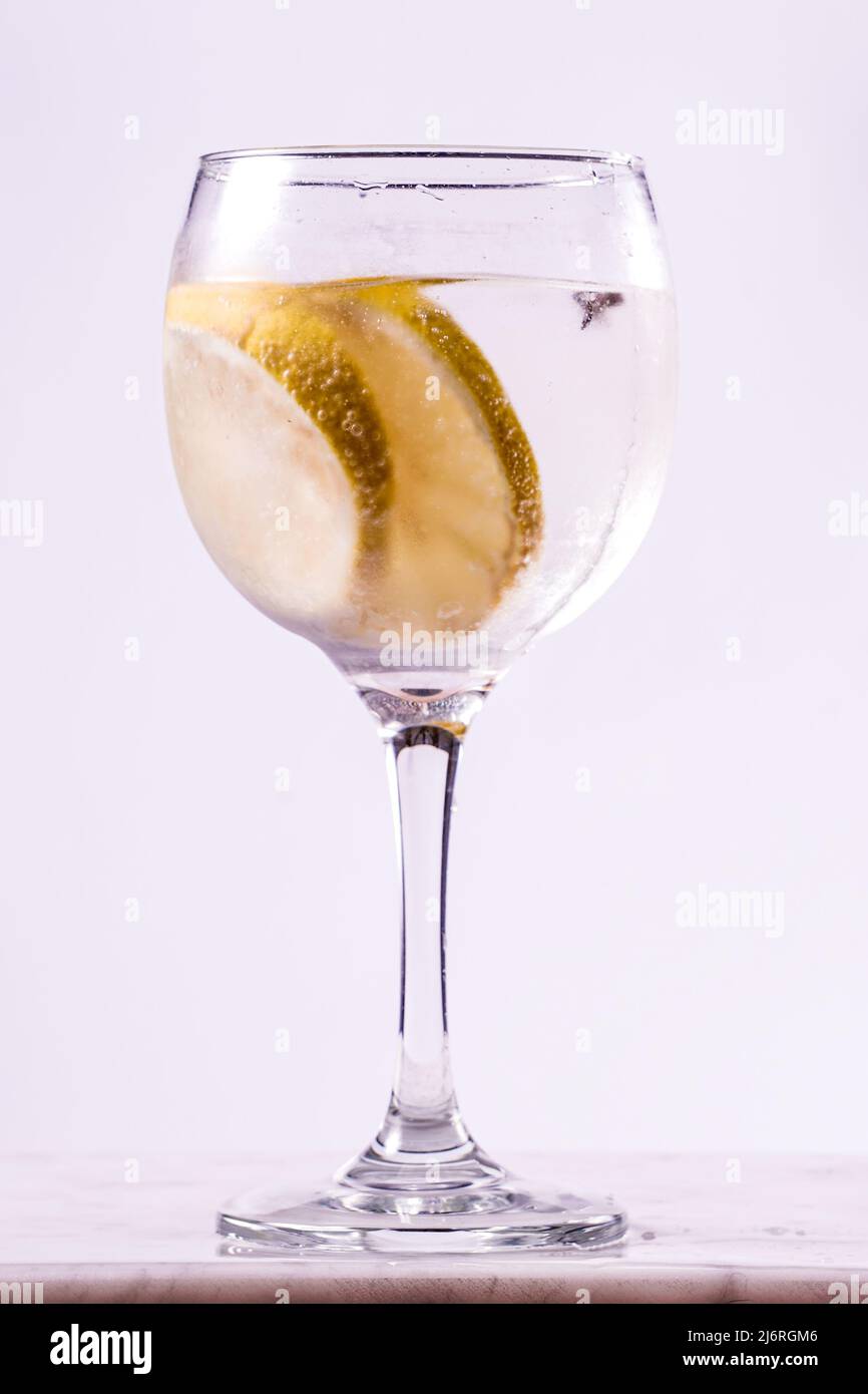 gin tonic glass with lemon slices on white background Stock Photo - Alamy