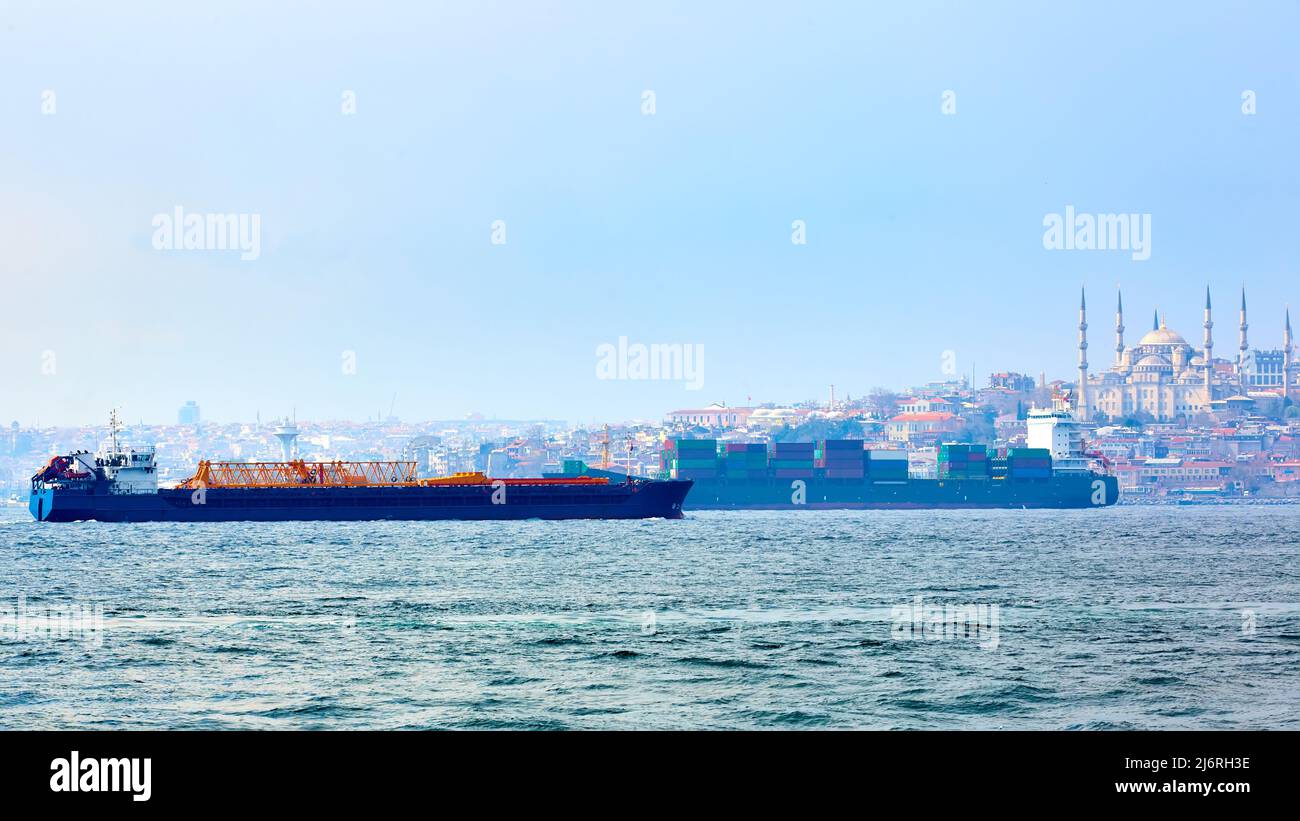 Fully loaded container ship and Oil tanker moving through Bosphorus ...