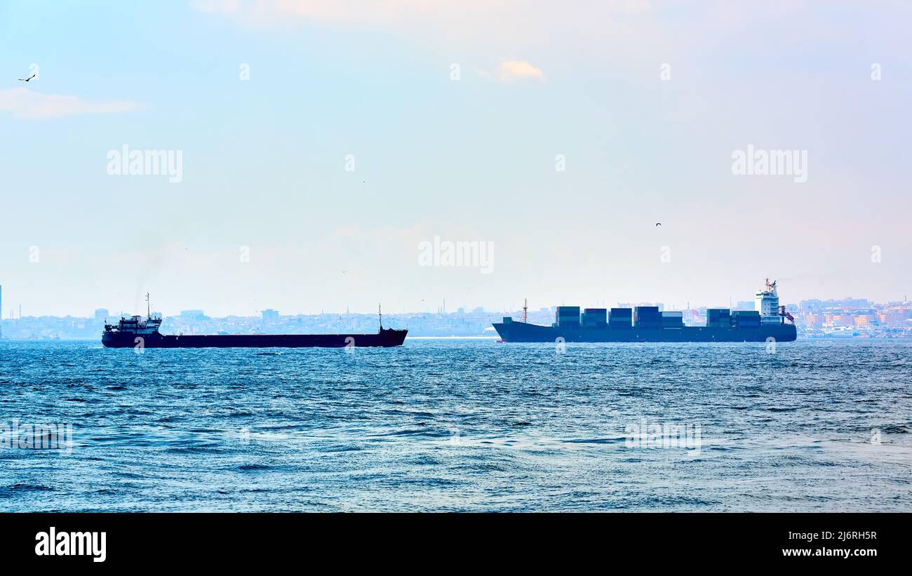 Fully loaded container ship and Oil tanker moving through Bosphorus ...