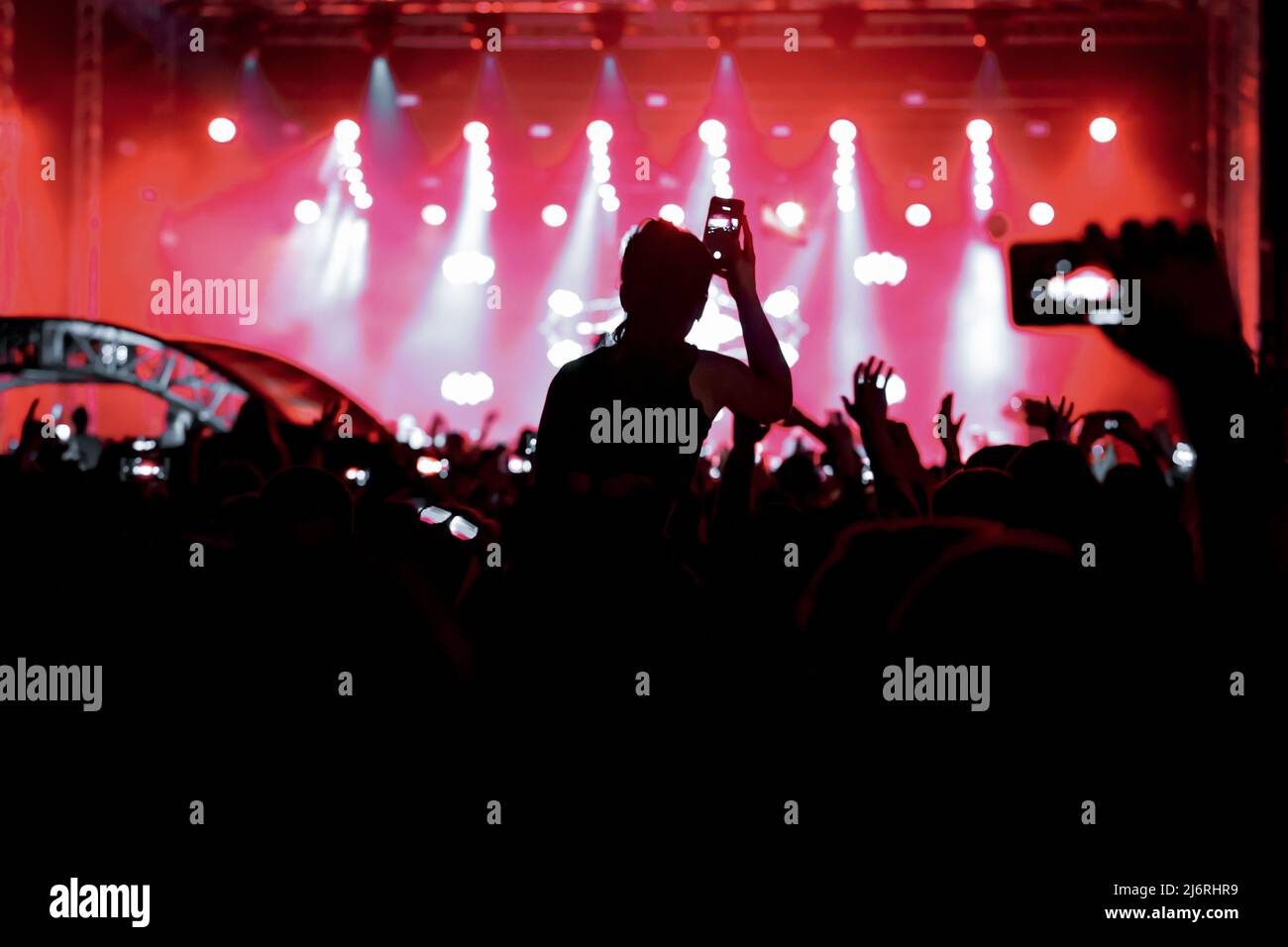 Girl on shoulders in the crowd at a music festival Stock Photo - Alamy