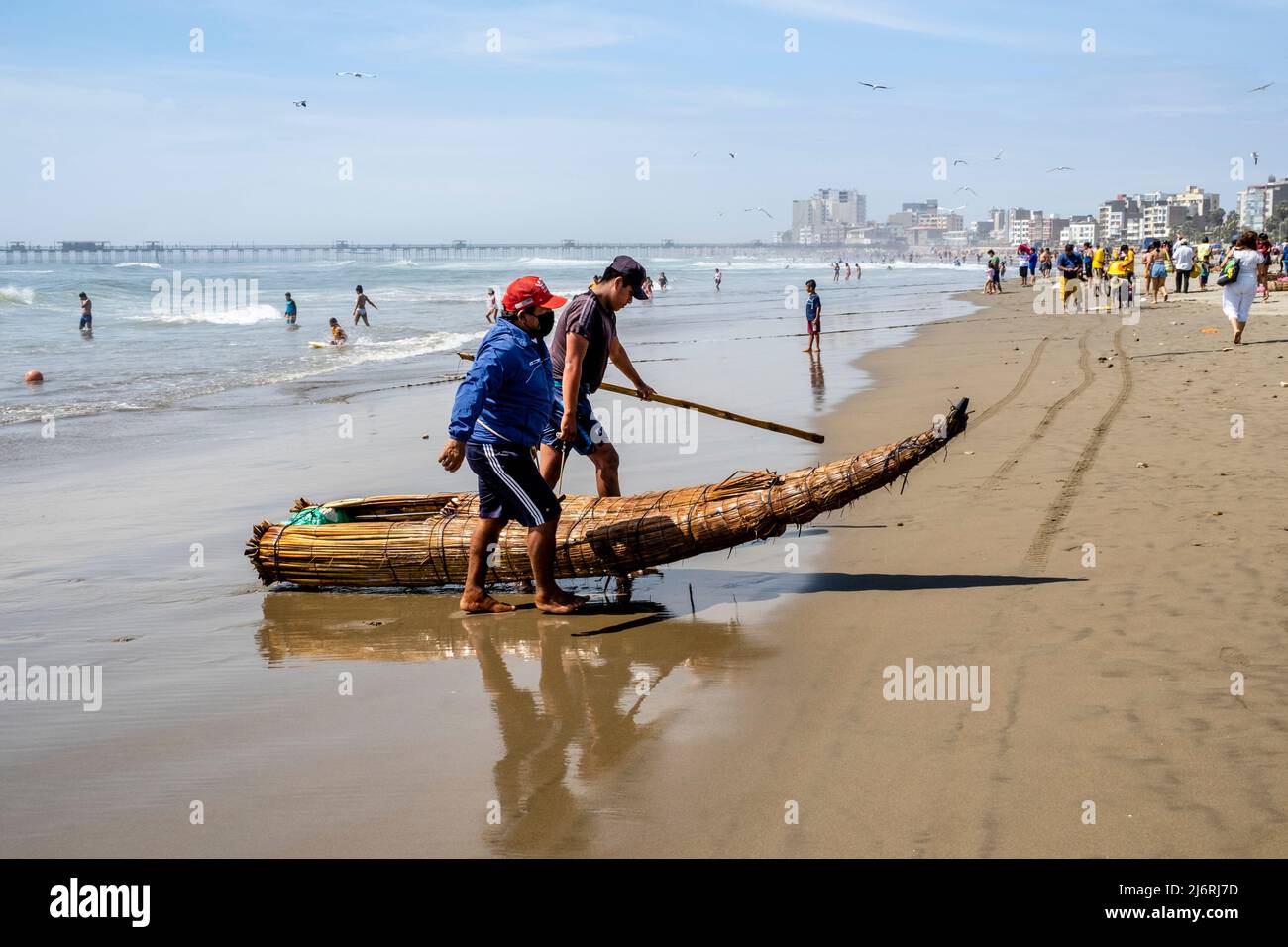 Fishermen Bringing Ashore A Caballito de Totoro (Traditional Reed Boat ...