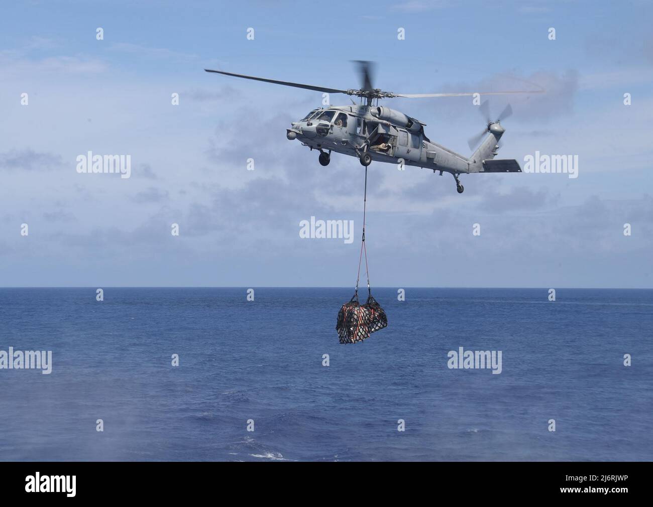 PHILIPPINE SEA (April 30, 2022) An MH60-R Sea hawk helicopter, assigned ...