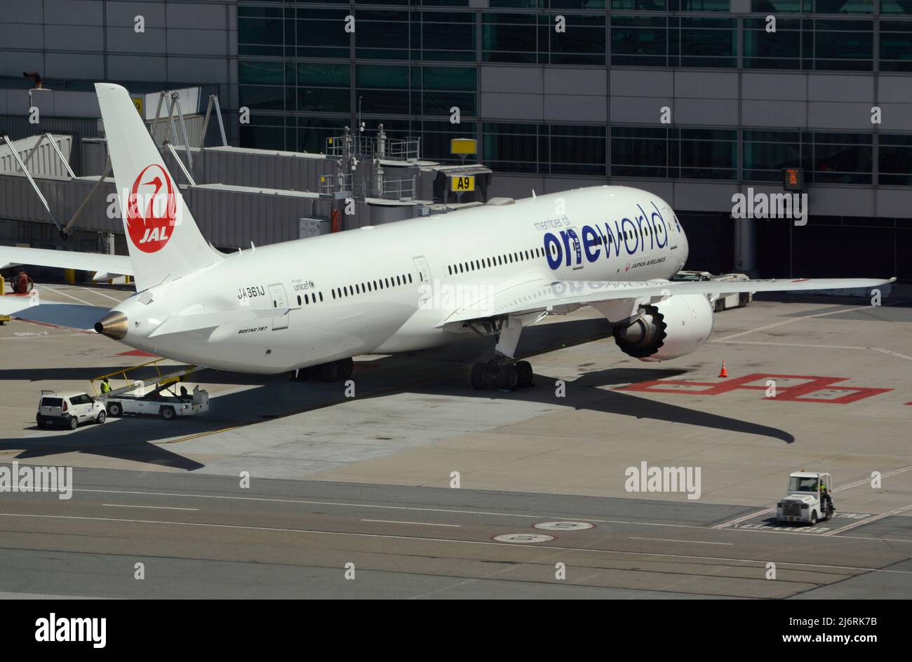 A Japan Airlines Boeing 787 passenger aircraft arrives at its gate at ...