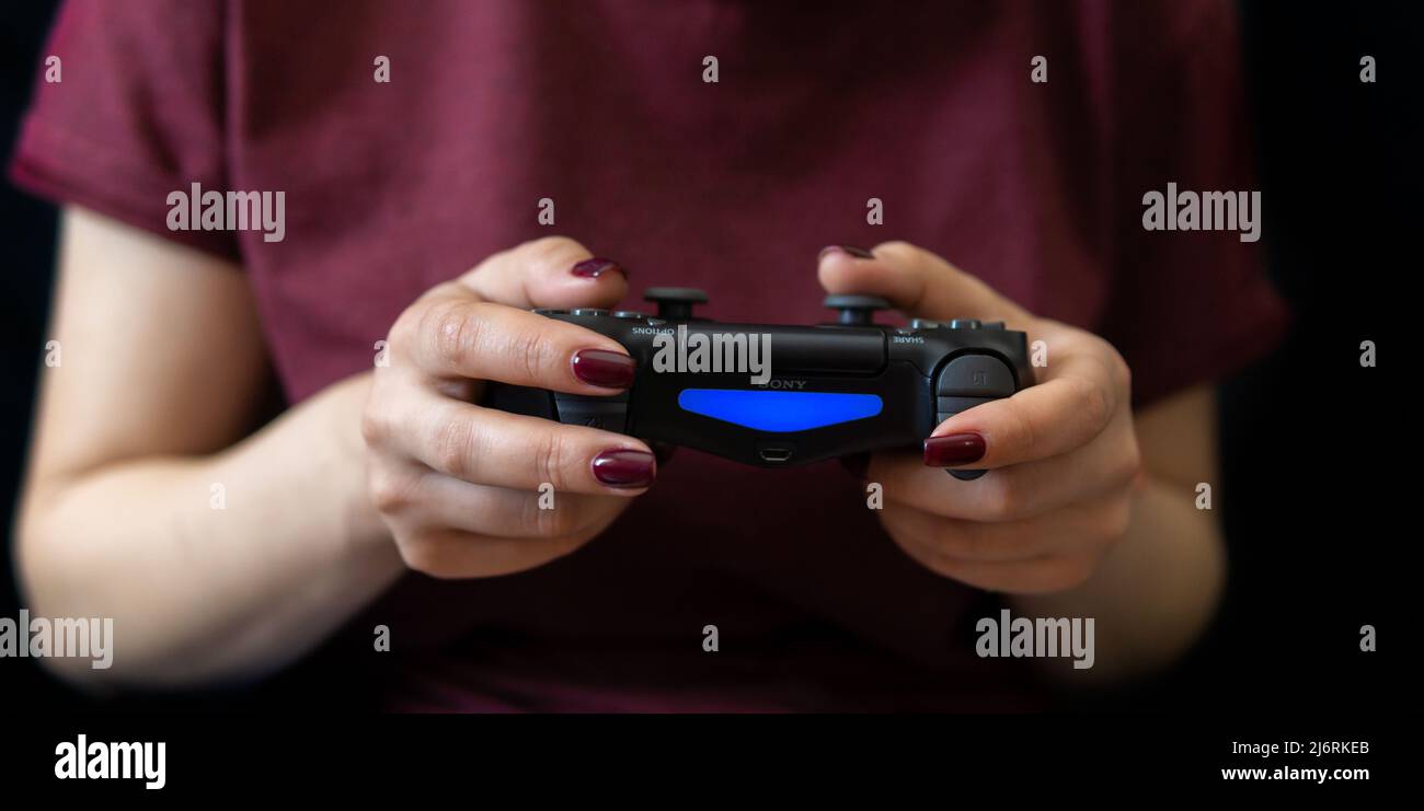 Ukraine, Odessa - July 2, 2019: A girl plays a video game on a ...