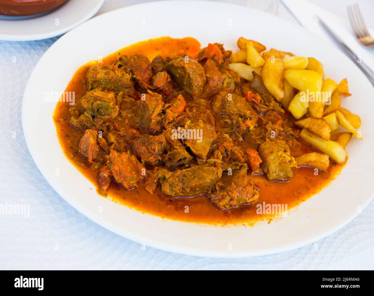 Appetizing baked pork cheeks Stock Photo - Alamy