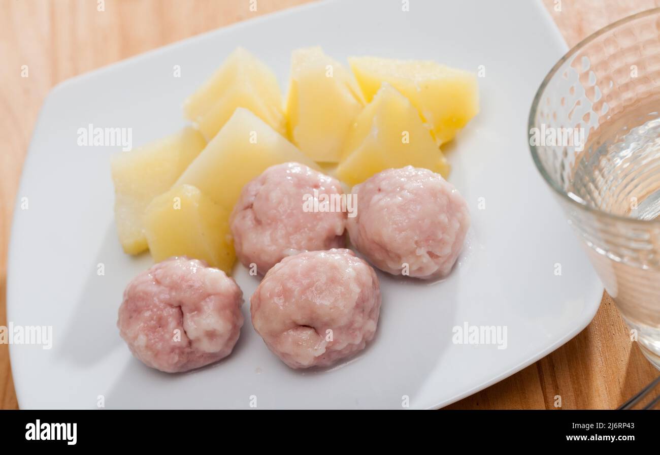 Steamed meatballs with potatoes Stock Photo - Alamy