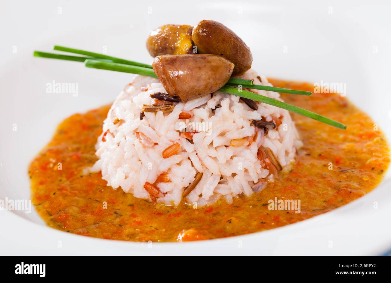 Boiled rice with chicken heart Stock Photo - Alamy