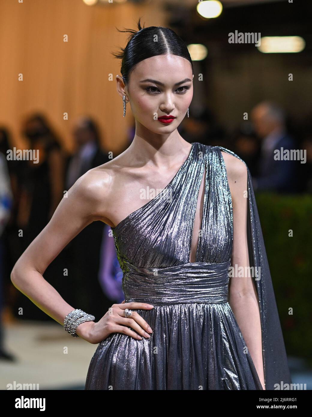 He Cong walking on the red carpet at the 2022 Metropolitan Museum of Art Costume Institute Gala ...
