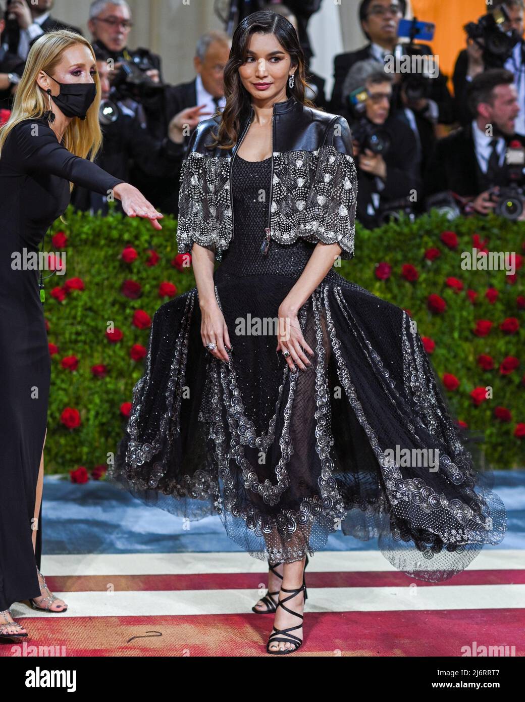 Gemma Chan walking on the red carpet at the 2022 Metropolitan Museum of ...