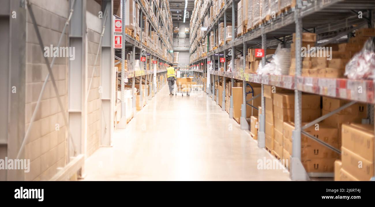 Female warehouse working pushing boxes hi-res stock photography and ...
