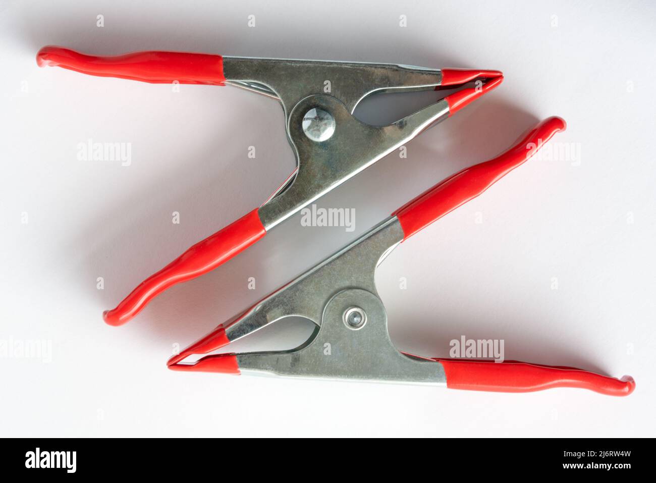 Metal Hand Clamps with Red Grips Stock Photo - Alamy