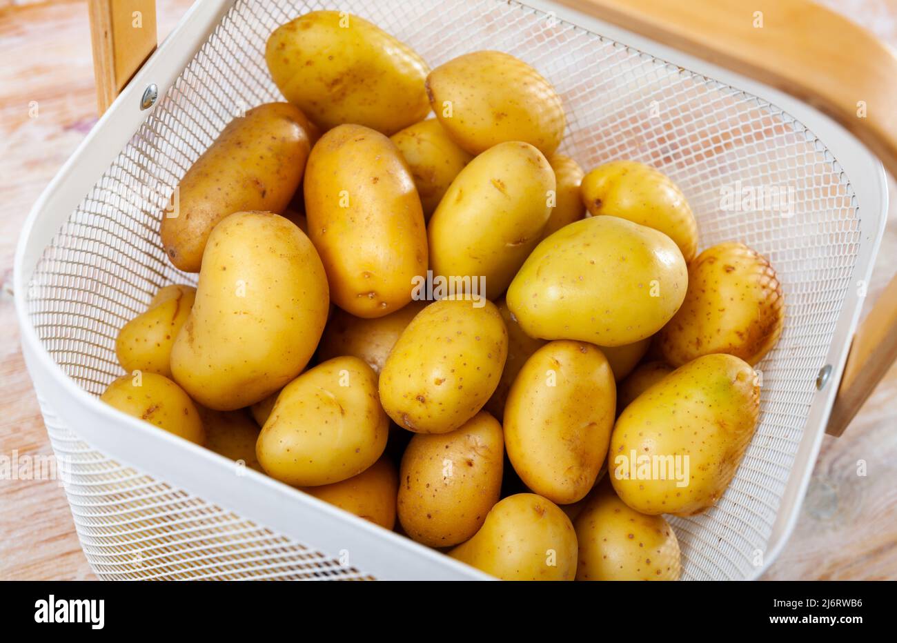 Image of freshly washed potatoes in a bucket Stock Photo - Alamy