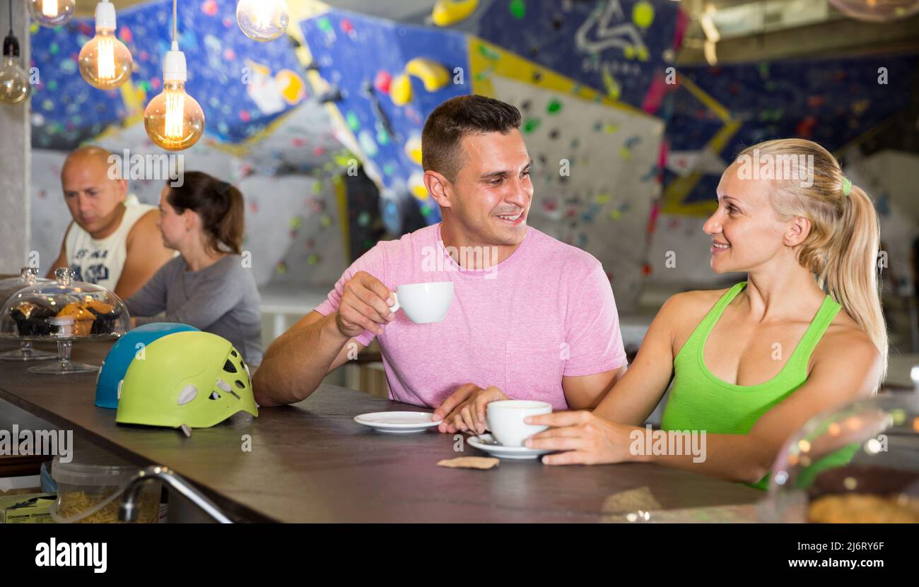 Athletic people on break during indoor climbing workout Stock Photo - Alamy