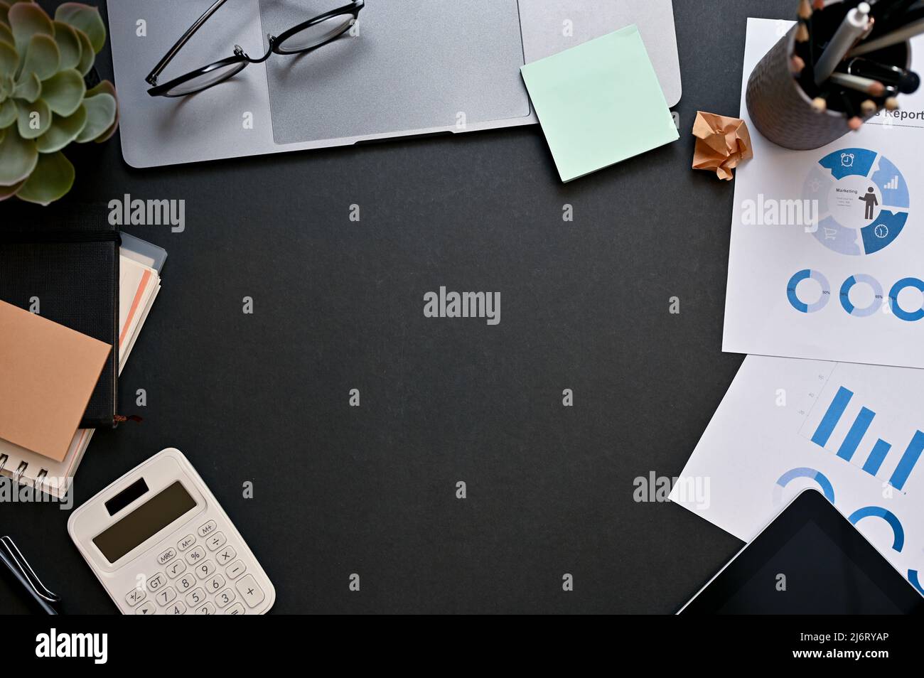 Modern black workspace background top view surrounded with office ...