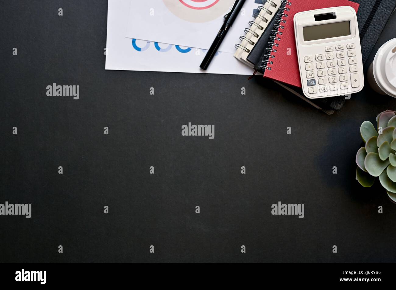 Black workspace background top view with business work equipments and ...