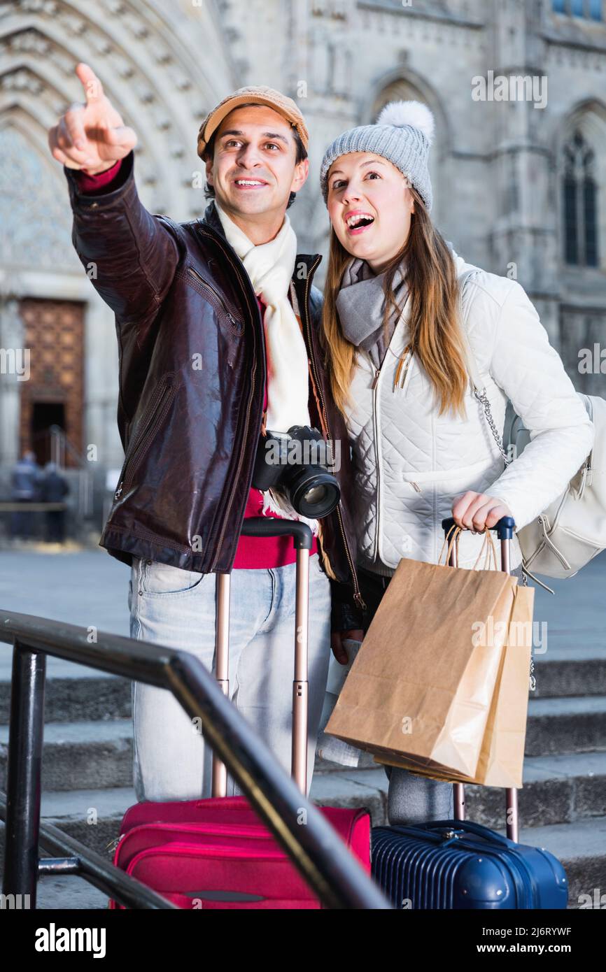 Male and female in the historic center pointing finger Stock Photo - Alamy