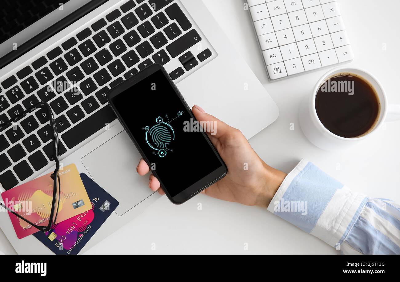Woman with smartphone using fingerprint scanner to login into personal ...