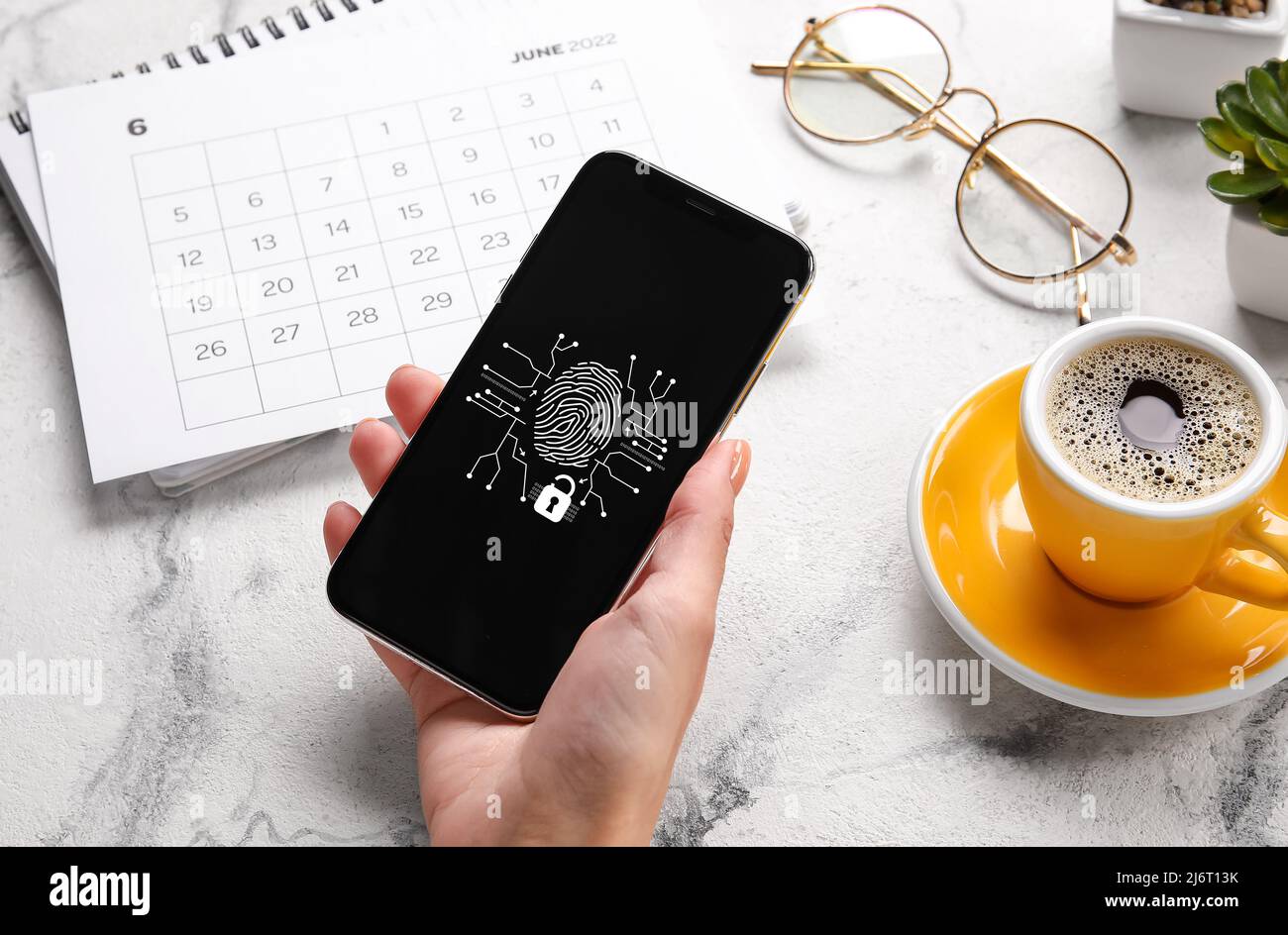 Woman with smartphone using fingerprint scanner to login into personal ...