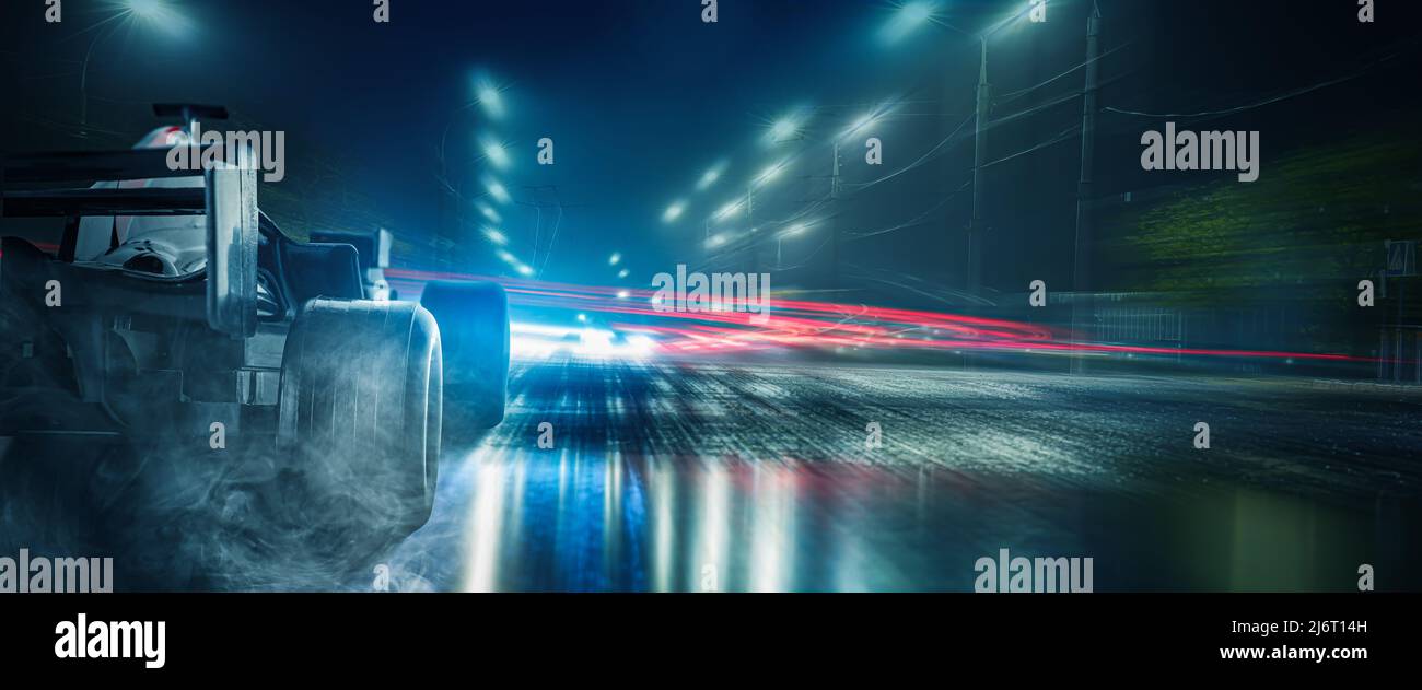 Modern fast racing car on night city street Stock Photo - Alamy