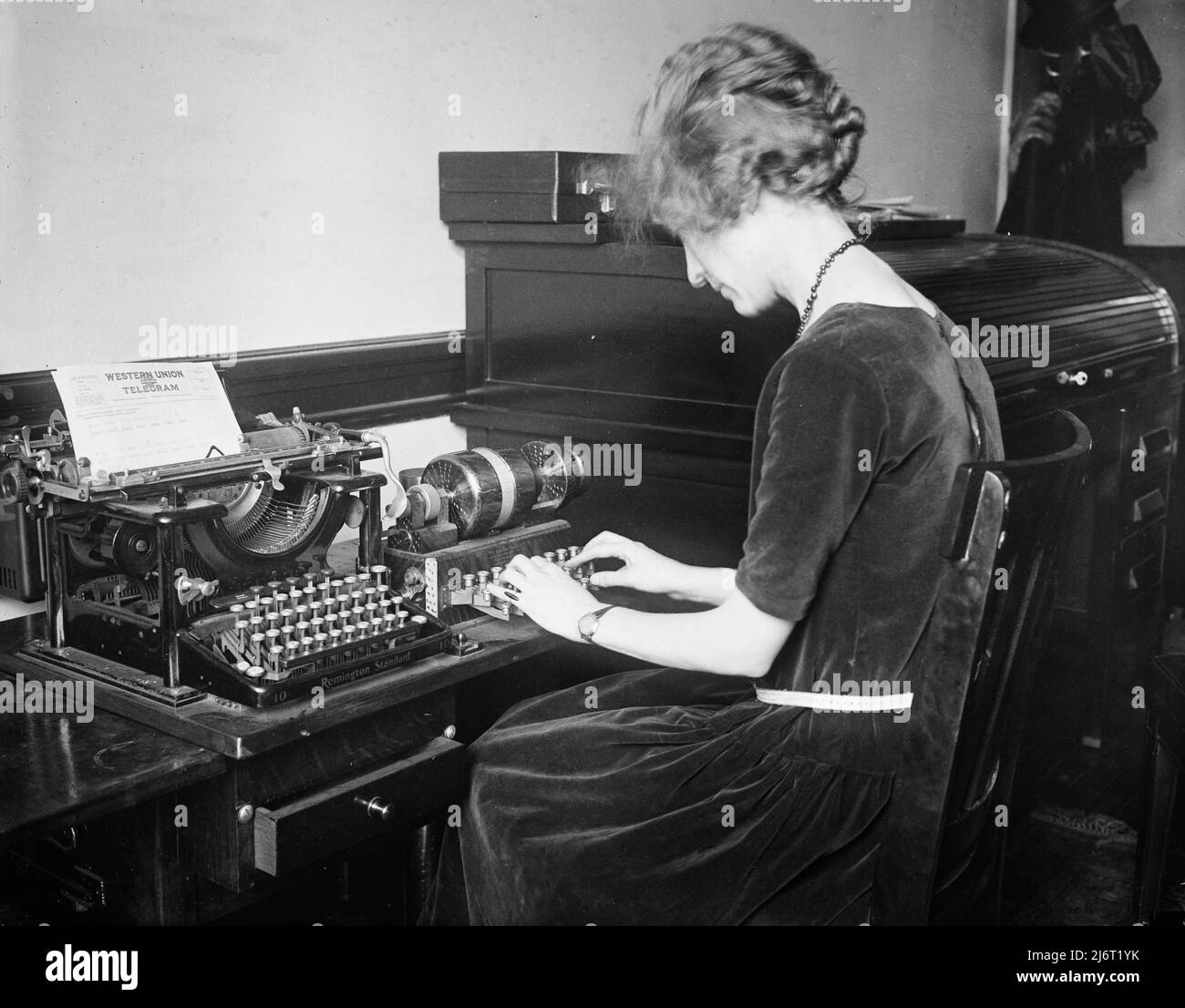 Telegraph operator using an electric code machine, 1923 Stock Photo - Alamy