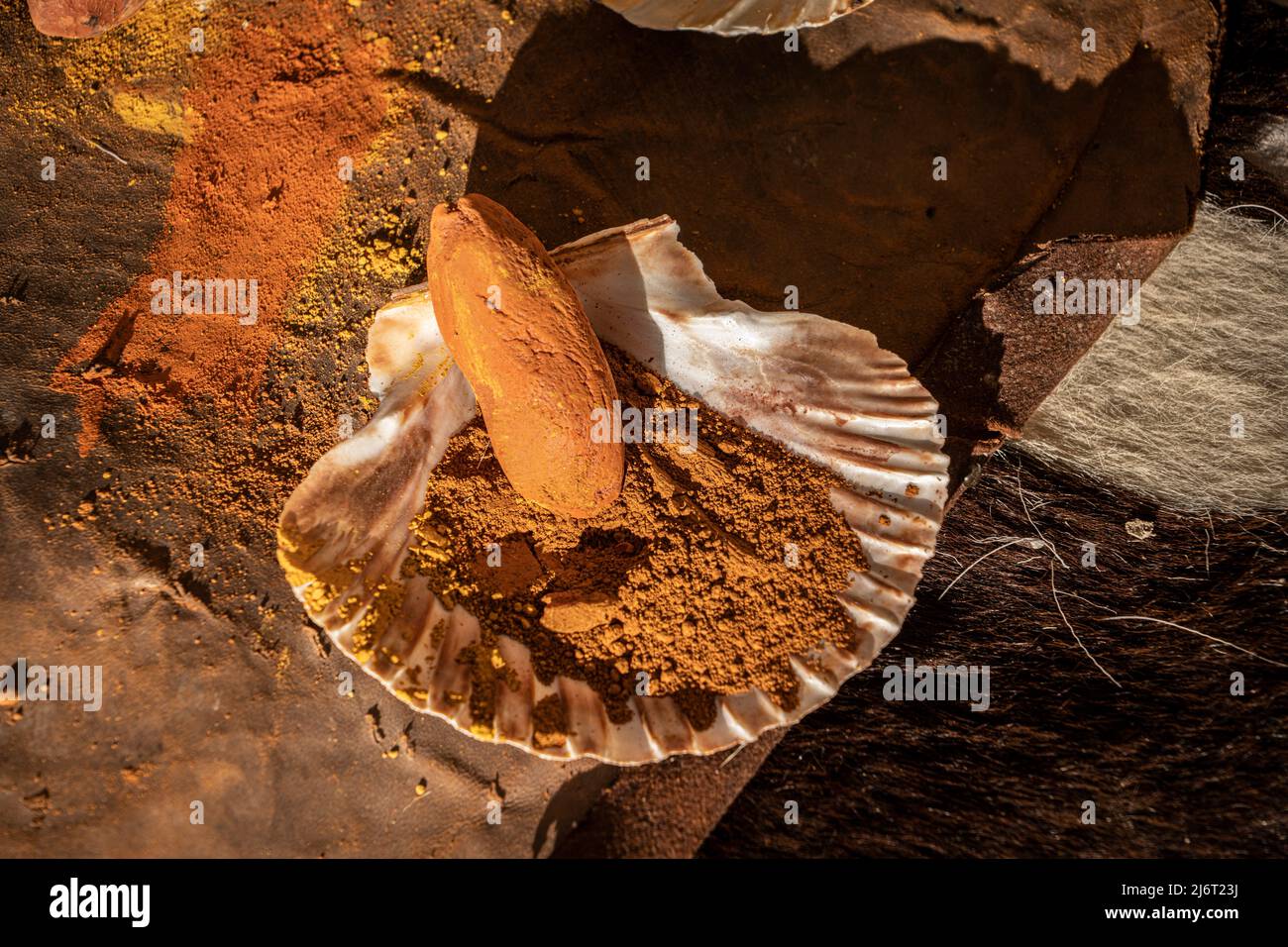 Grinded ochre pigment in a shell Stock Photo - Alamy