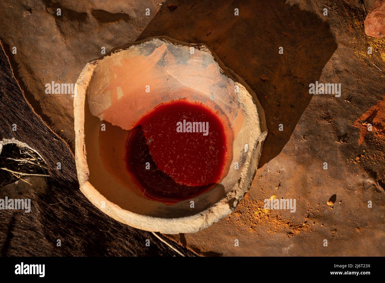 Crushed ochre pigment mixed with water Stock Photo - Alamy