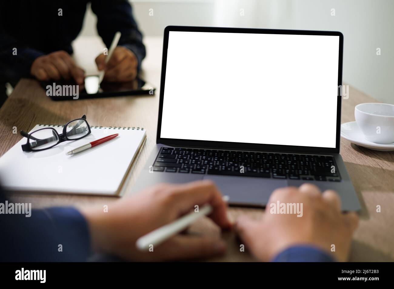 mockup blank screen computer man using laptop on desk in office laptop ...