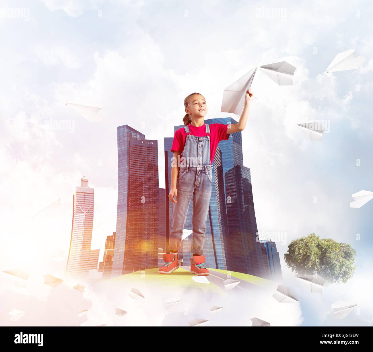 Concept of careless happy childhood with girl dreaming about future ...