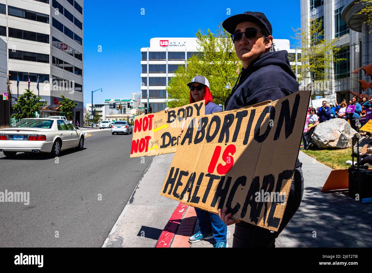 Protestors hold signs expressing their opinion during the demonstration ...