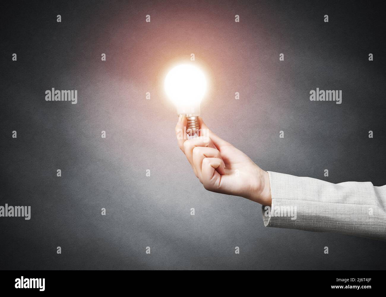 Human hand with glowing incandescent lamp Stock Photo - Alamy