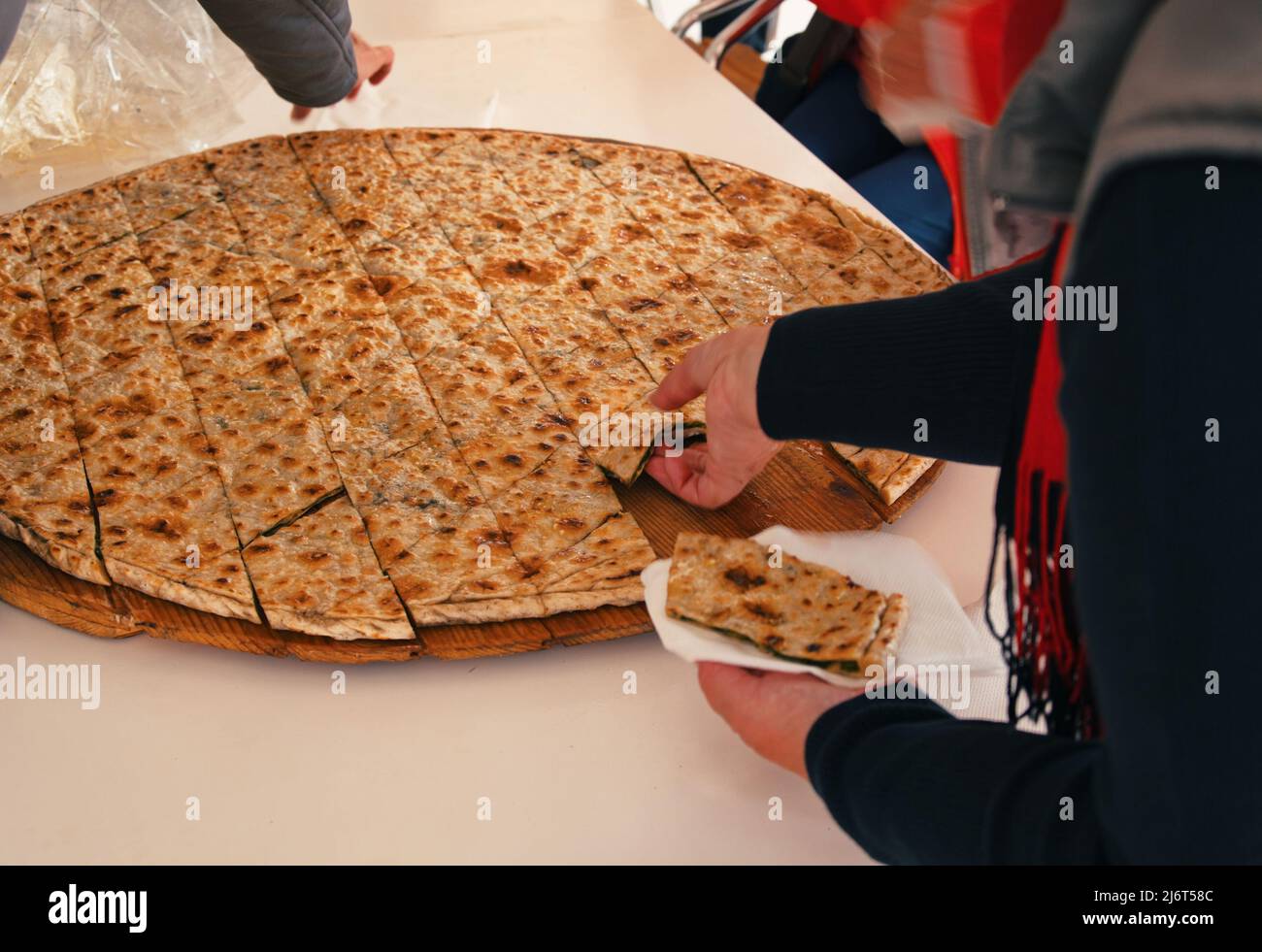 Traditional Croatian food on big wooden plate Stock Photo - Alamy
