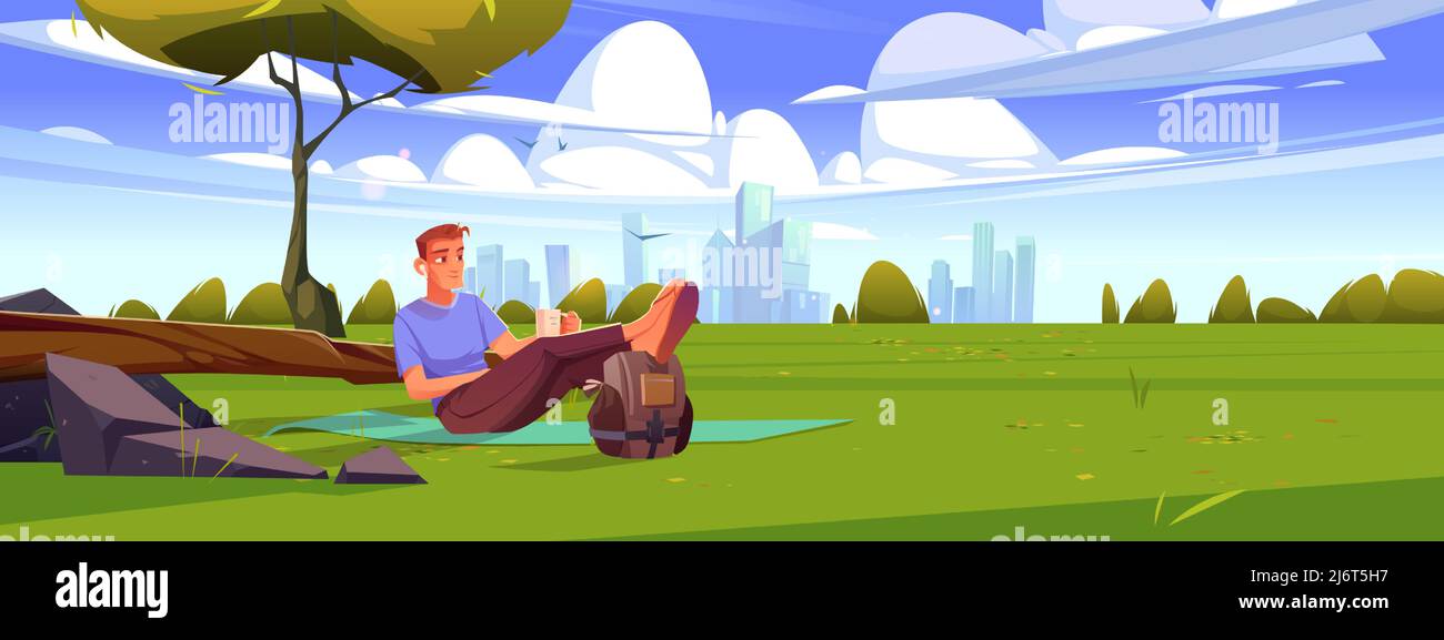 Man rest on green lawn with trees, bushes and city buildings on horizon ...