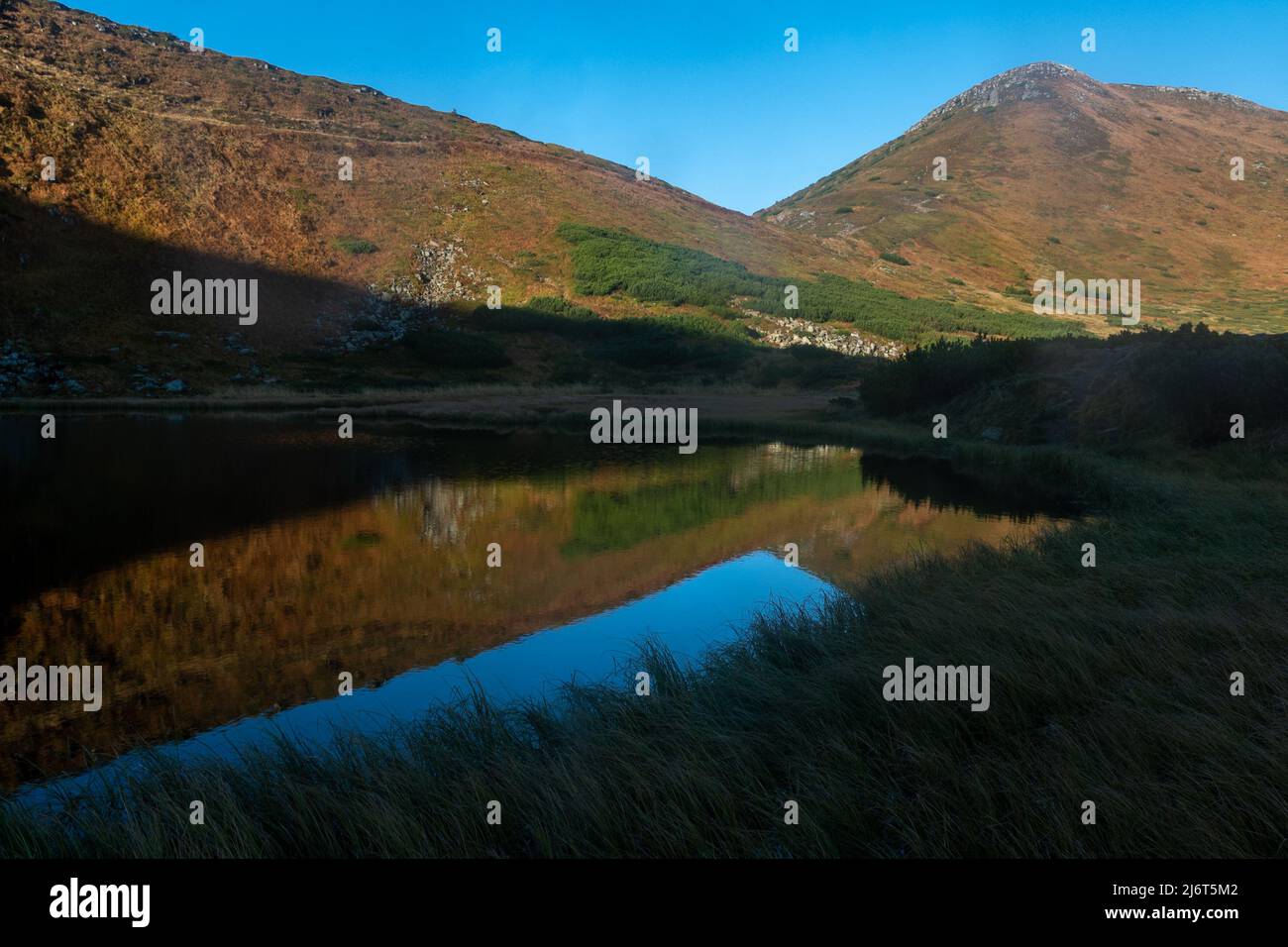 Reflection of Mount Turku in the reservoir of Lake Nesamovyto, Lake ...