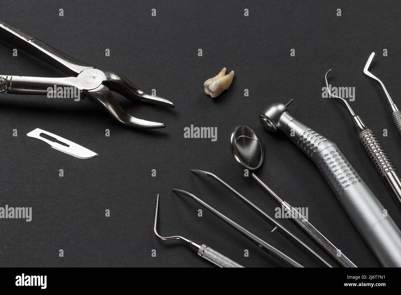 Dental pliers and a blade. Plugger, tweezers, a mouth mirror, a dental ...