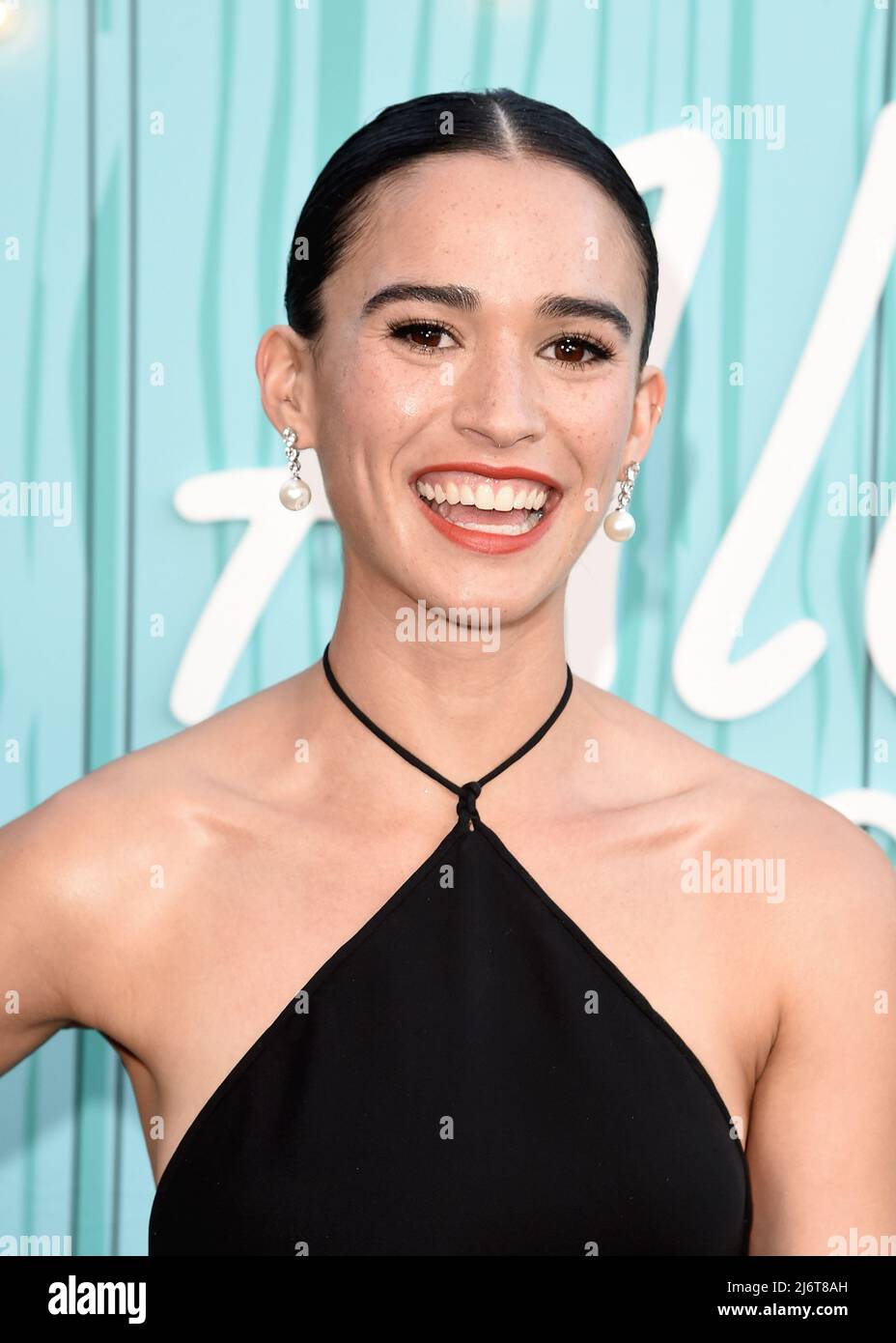 Emma Pasarow walking on the red carpet at the global premiere of "Top ...