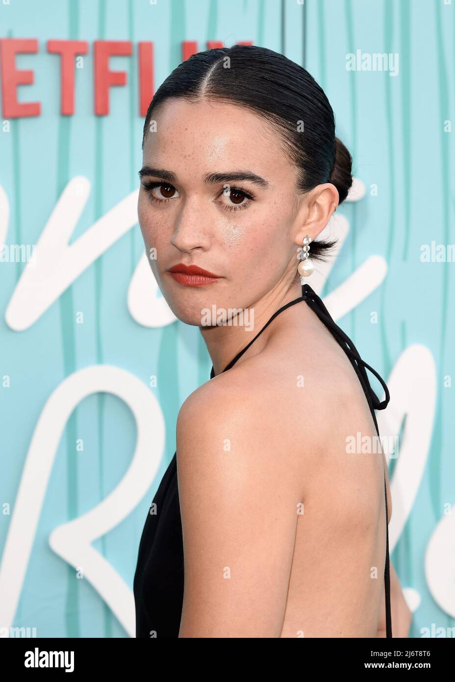 Emma Pasarow walking on the red carpet at the global premiere of "Top ...